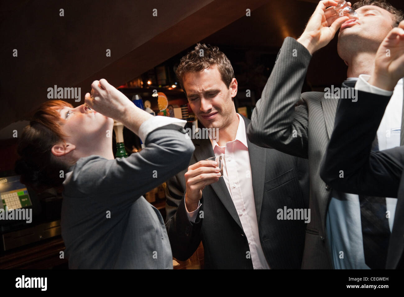 Businesspeople drinking at a bar Stock Photo - Alamy