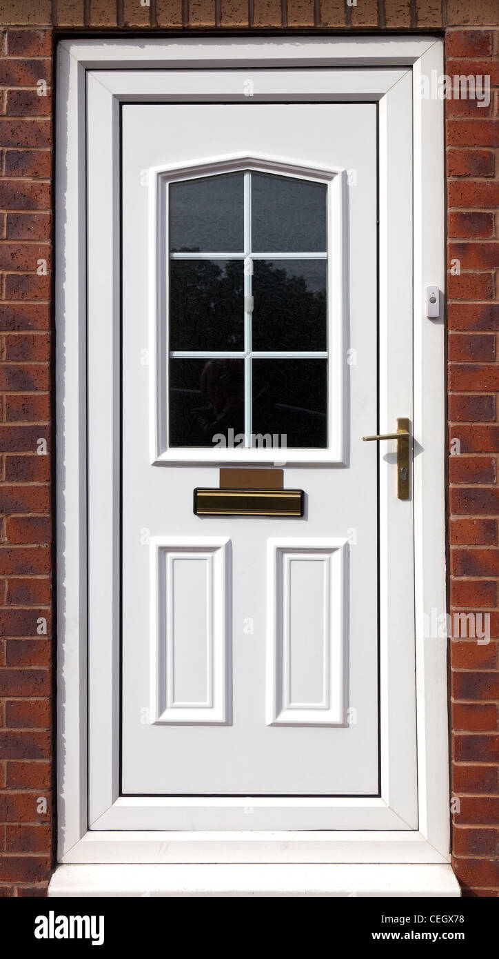 white front door in a red brick building,uk Stock Photo - Alamy