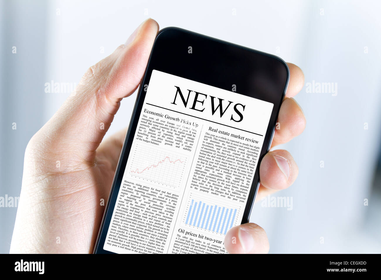 A man holding mobile smart phone with news article on screen. Closeup ...