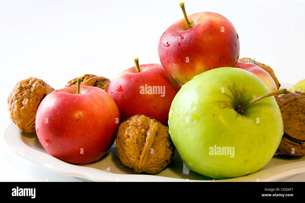 Autumn fruits in white plate Stock Photo - Alamy