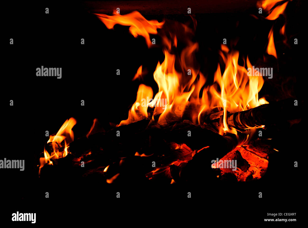 Detail of fire in open fireplace Stock Photo - Alamy