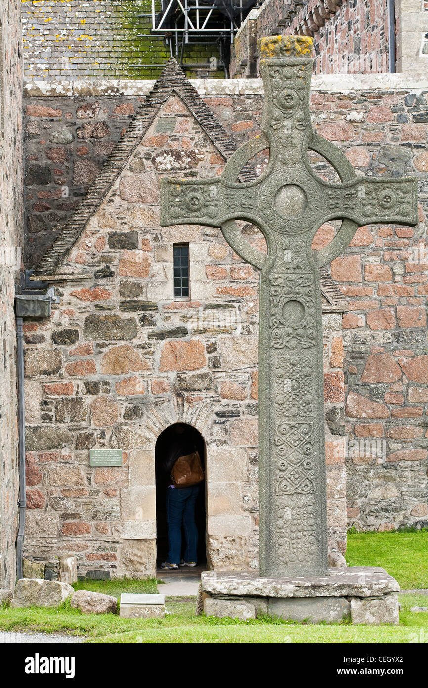 A stone cross outside the entrance to St Columba's shrine on Iona close ...