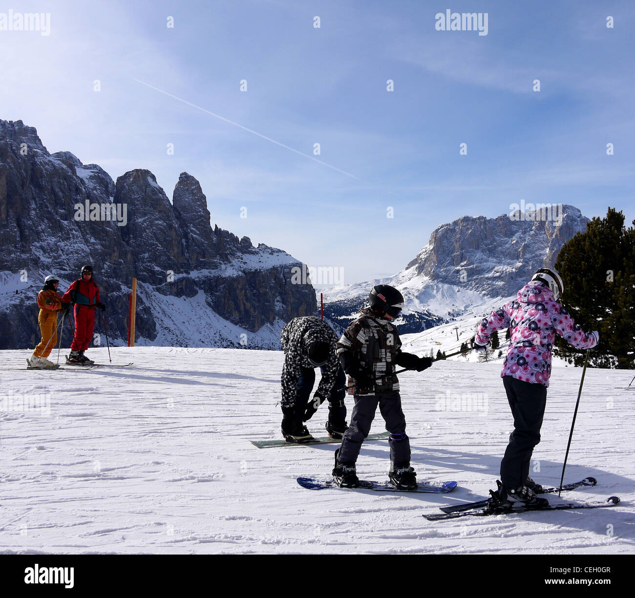 Skiers and snowboarders on the Sella Ronda ski circuit between Corvara ...