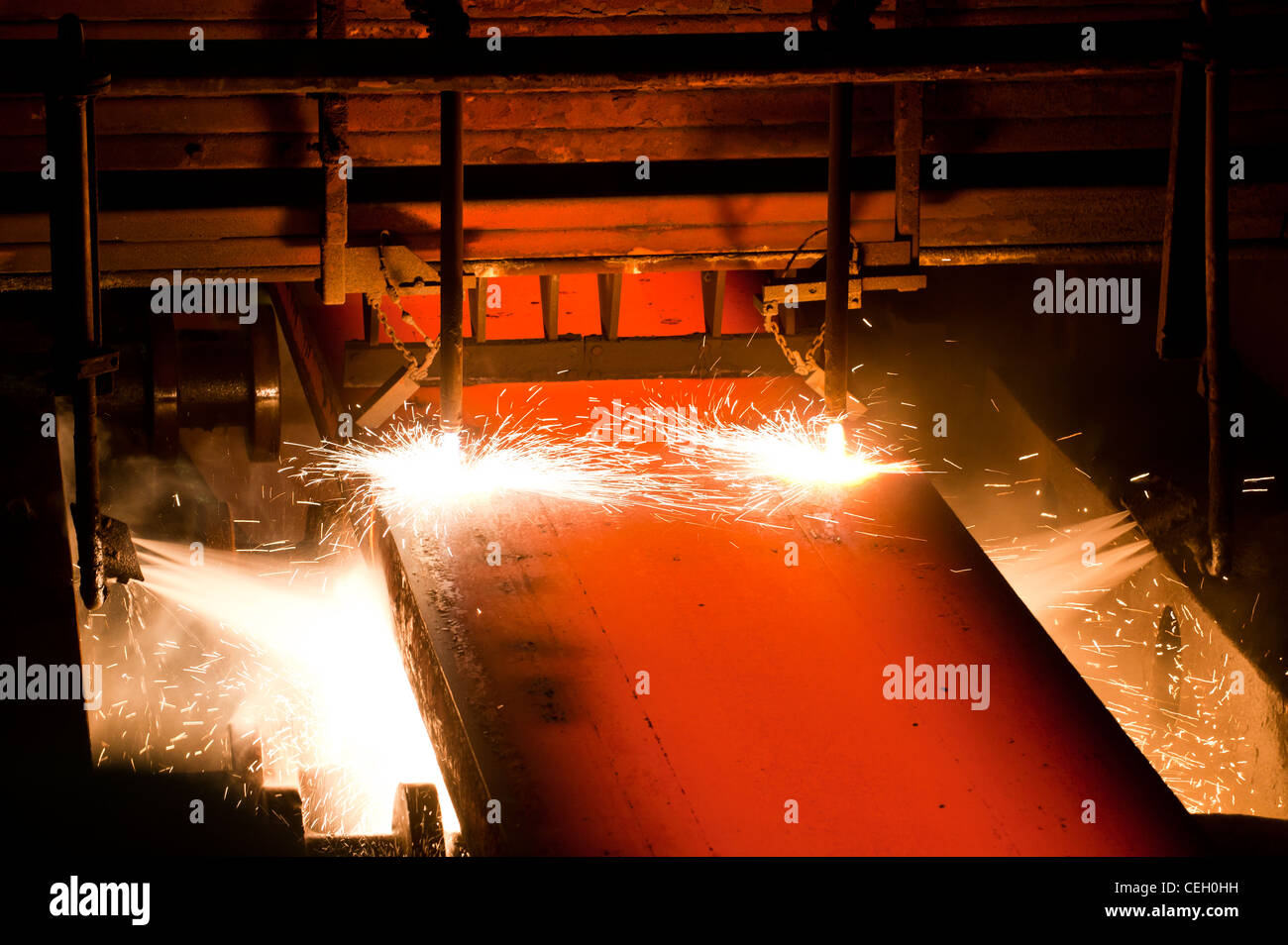 Gas cutting of the hot metal inside of plant Stock Photo - Alamy