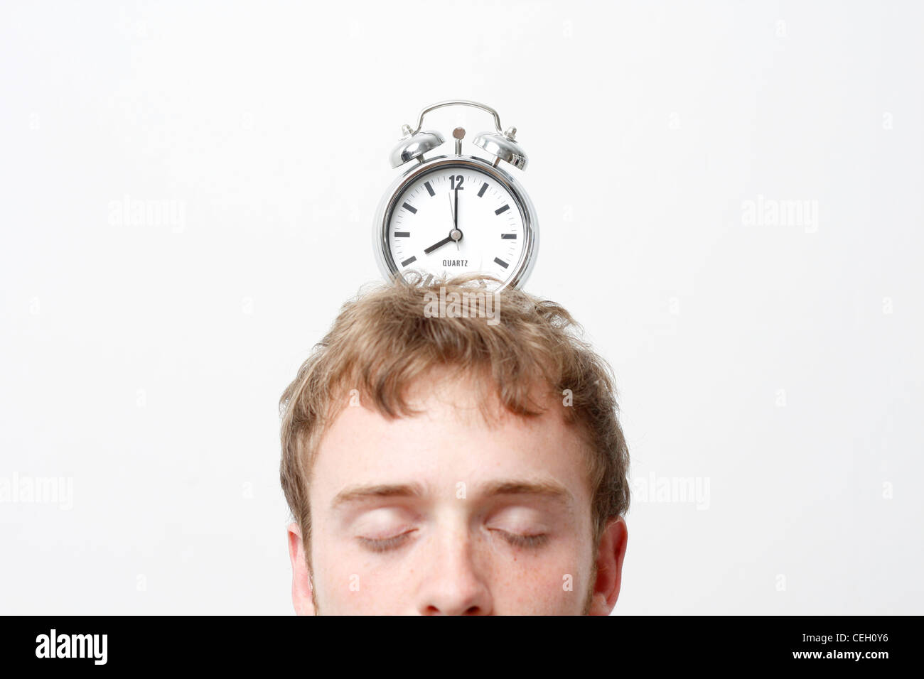 Boy waking up with alarm clock hi-res stock photography and images - Alamy