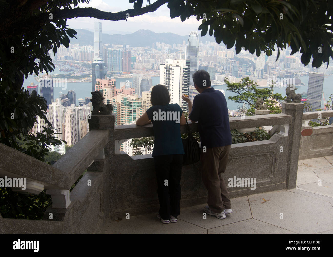 Sightseeing couple on The Peak viewing platform, Hong Kong Island Stock ...