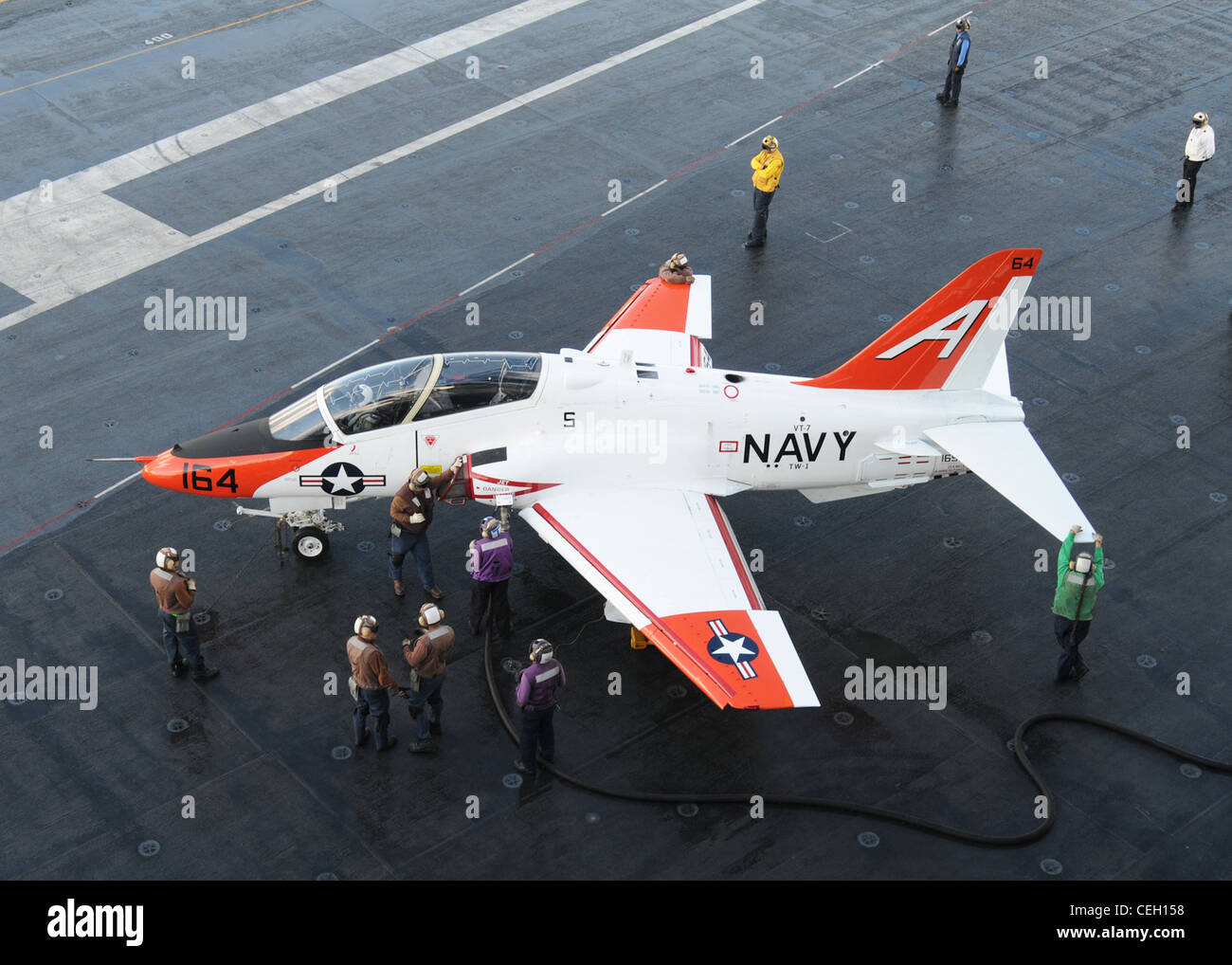 Sailors refuel a T-45 Goshawk assigned to Training Wing 1 on the flight ...