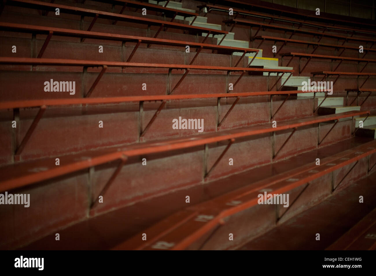 Empty bleacher grandstand rows of seats in a large auditorium Stock ...