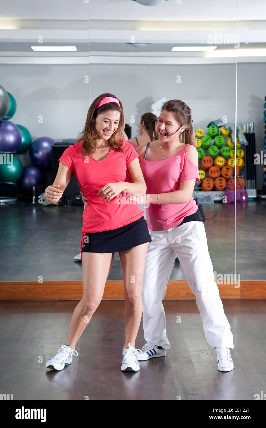 Latin American Zumba dance instructed at a fitness class in UK Stock ...