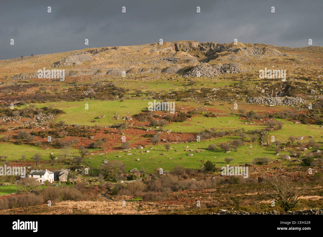 Swelltor quarry on Dartmoor in autumn with isolated farmhouse at the ...
