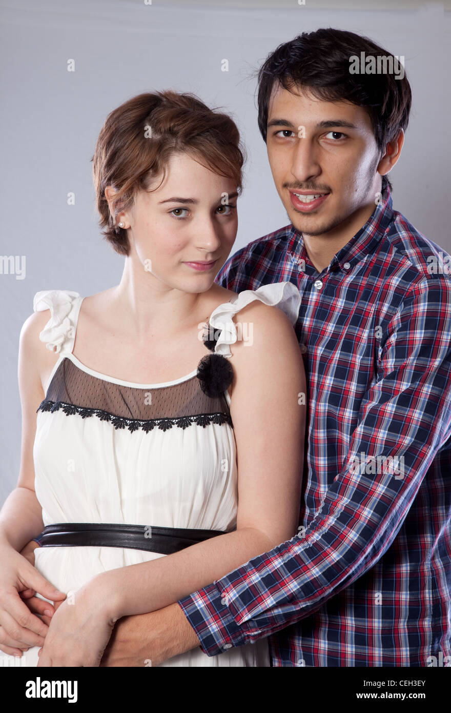 Cute white couple snuggling together, in a tender, romantic moment of ...