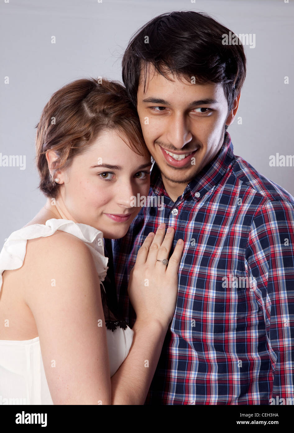 Cute white couple snuggling together, in a tender, romantic moment of ...