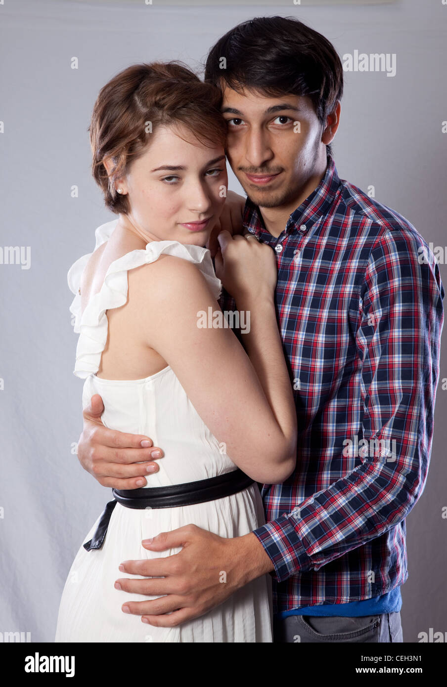 Cute white couple snuggling together, in a tender, romantic moment of ...