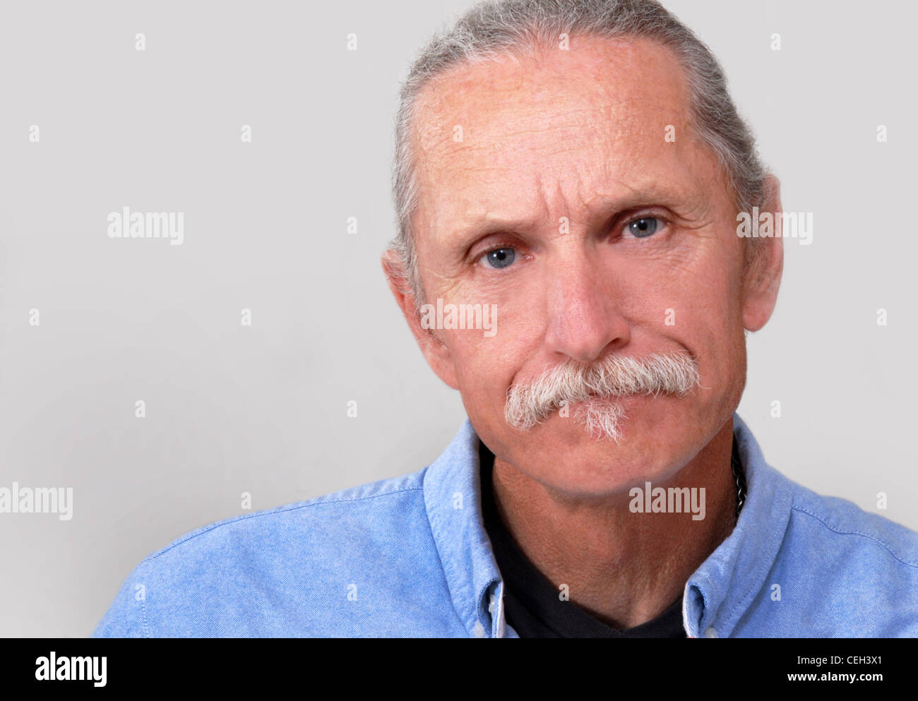 Middle aged man looking worried, concerned angry. On white background ...