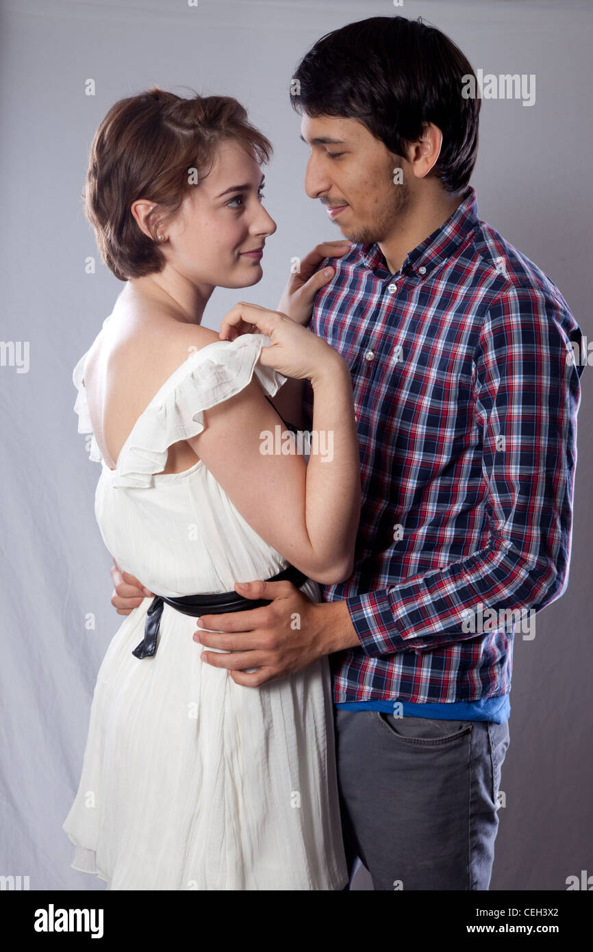 Cute white couple snuggling together, in a tender, romantic moment of ...