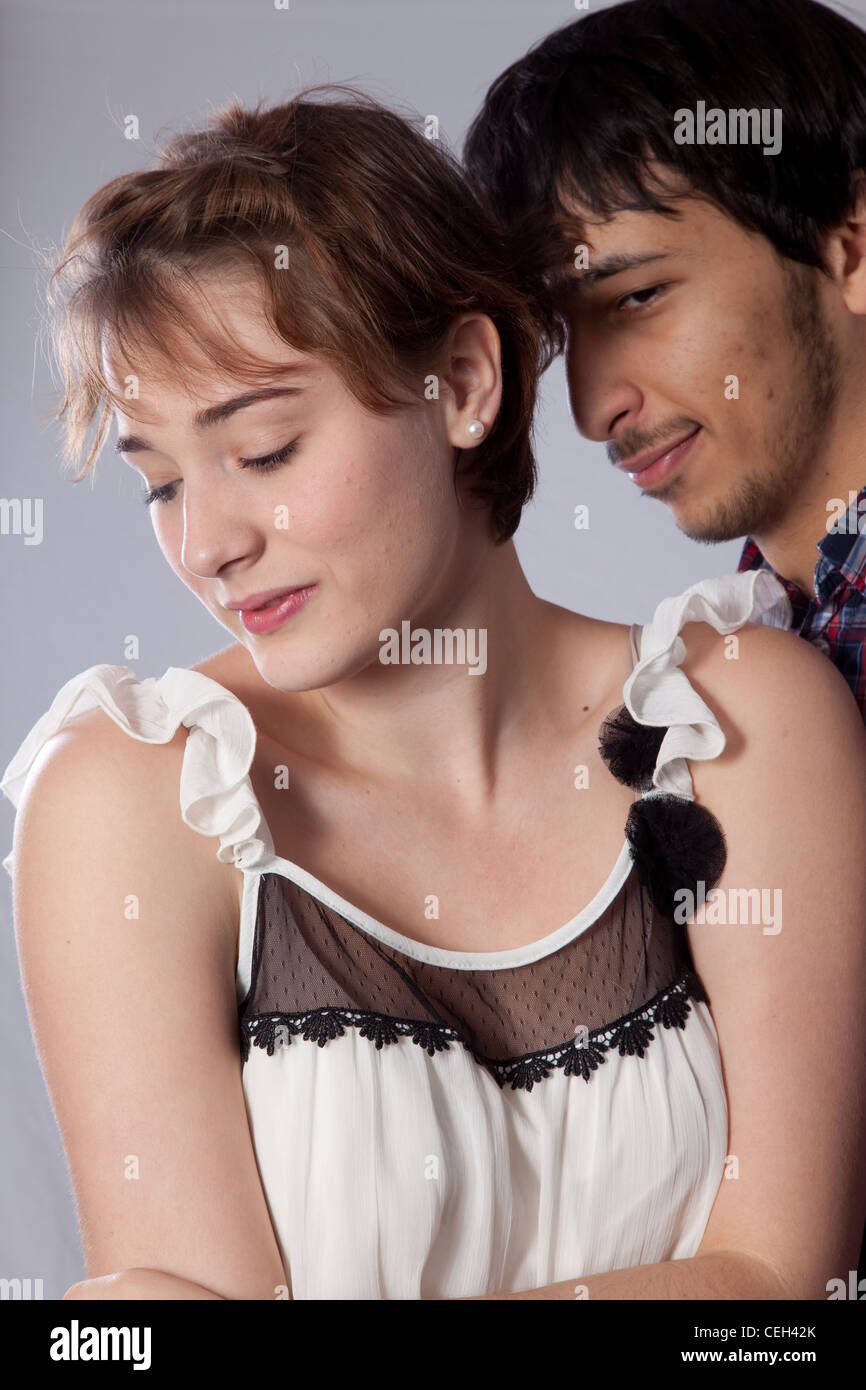 Cute white couple snuggling together, in a tender, romantic moment of ...