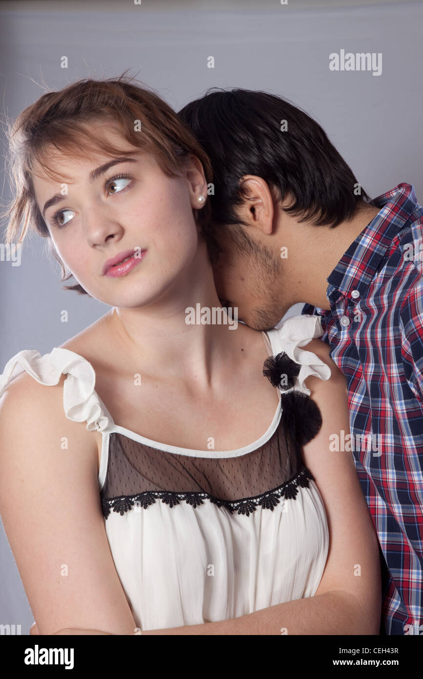 Cute white couple snuggling together, in a tender, romantic moment of ...