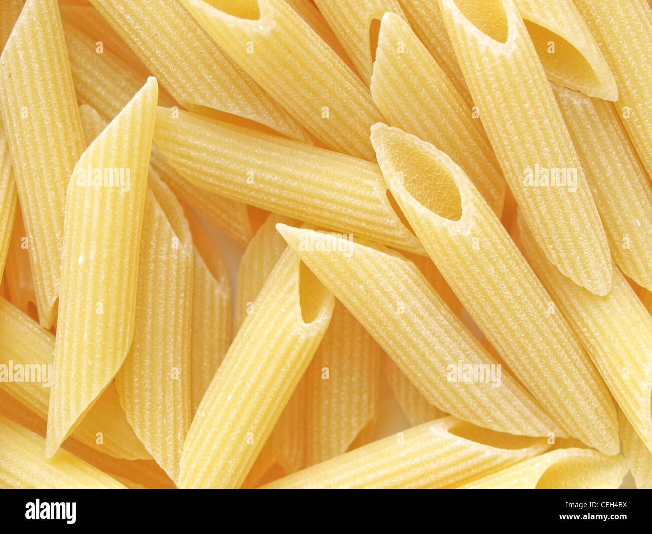 Italian macaroni penne pasta useful as a background Stock Photo - Alamy