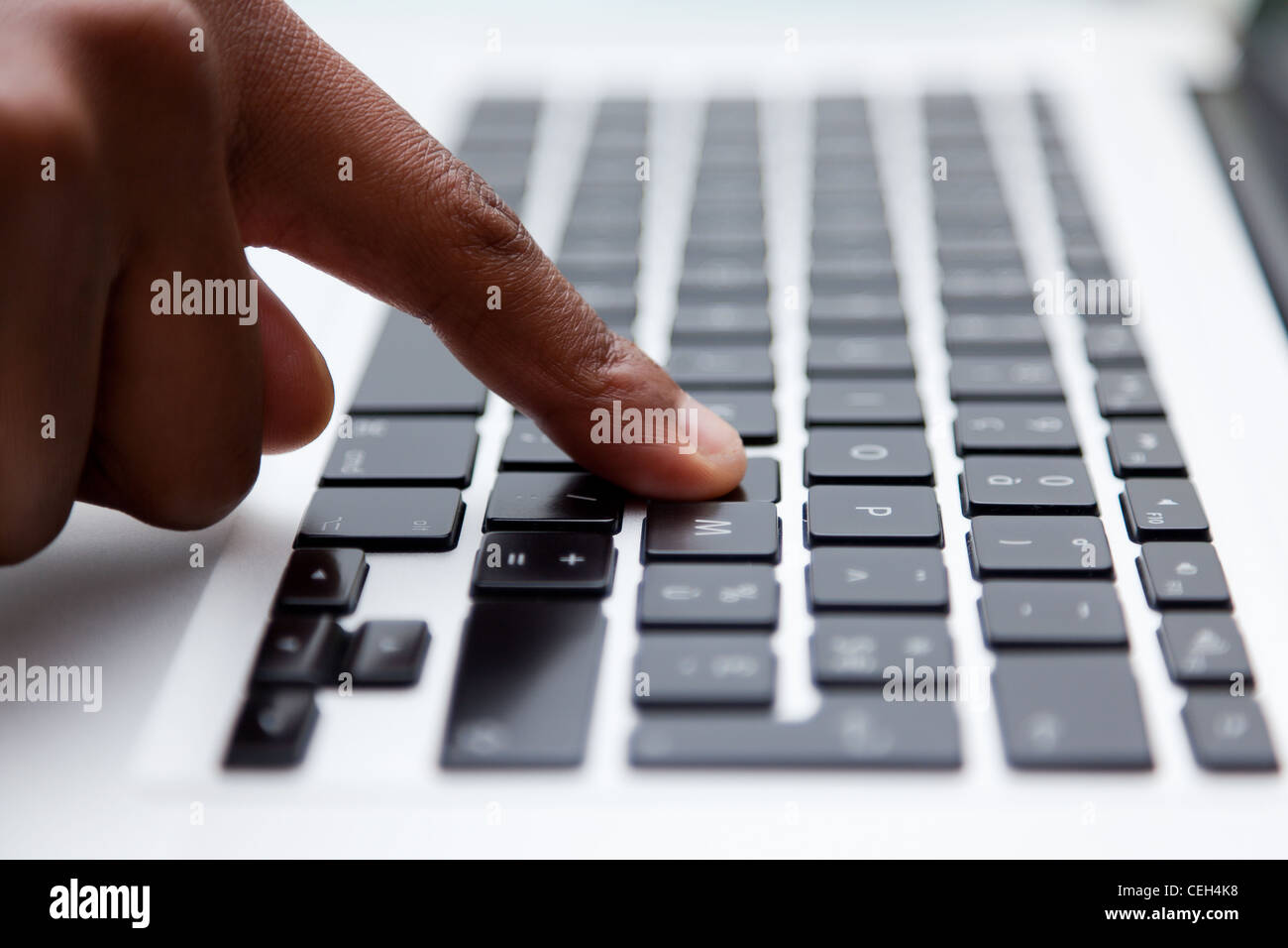 Female finger typing on computer keyboard Stock Photo - Alamy