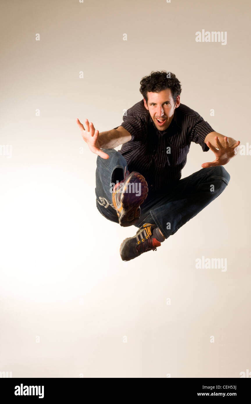 young man jumping Stock Photo - Alamy