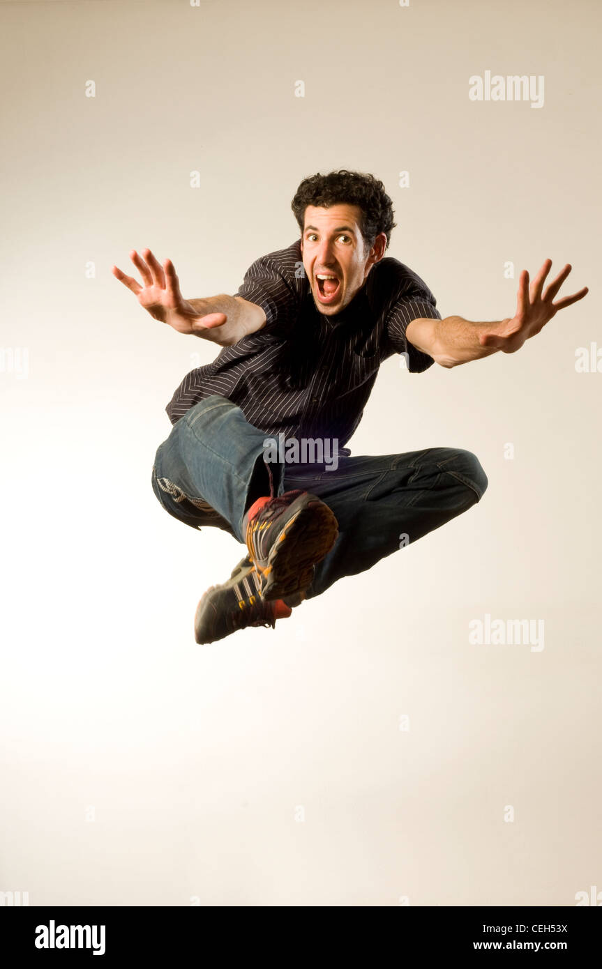 young man jumping Stock Photo - Alamy