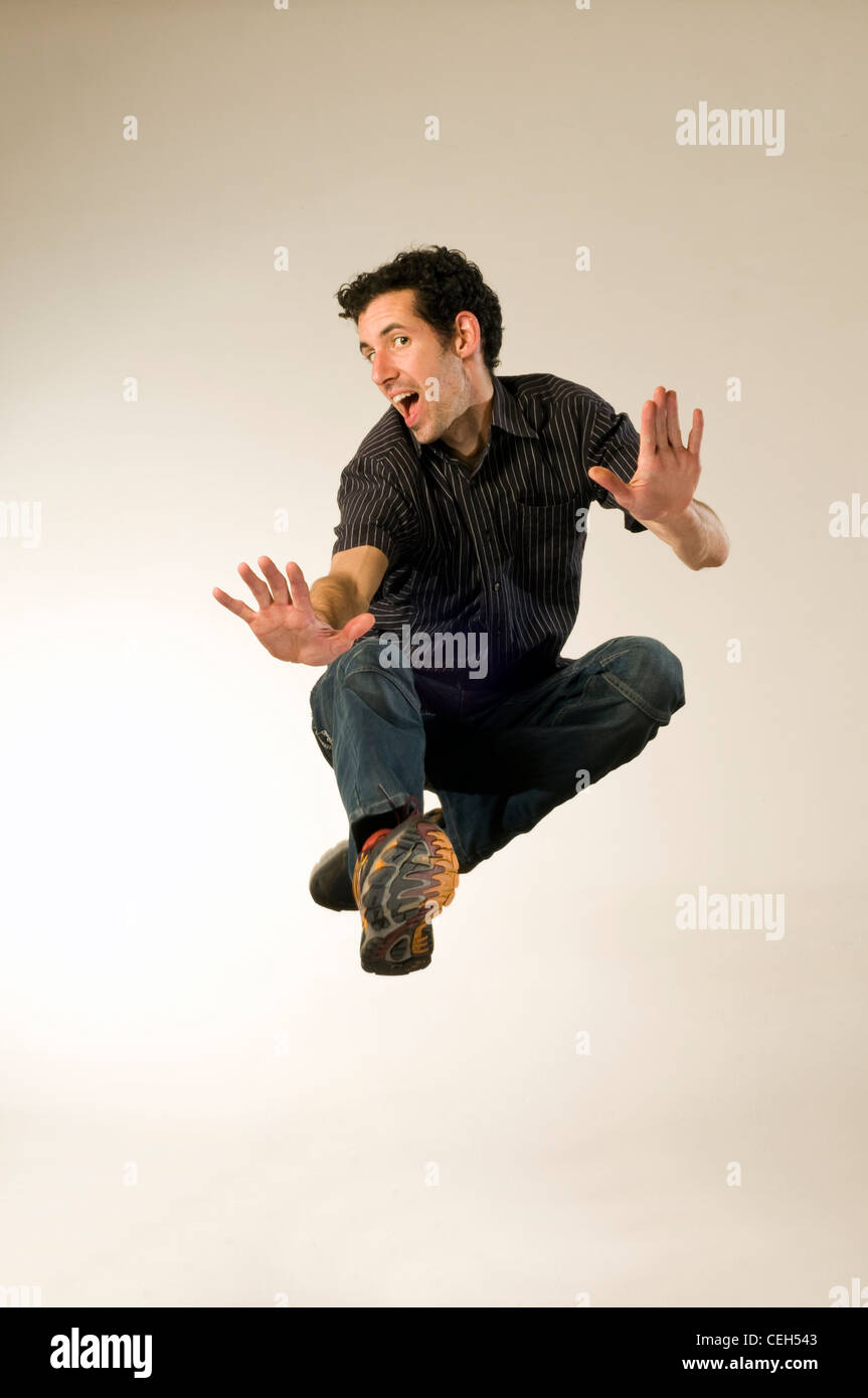 young man jumping Stock Photo - Alamy