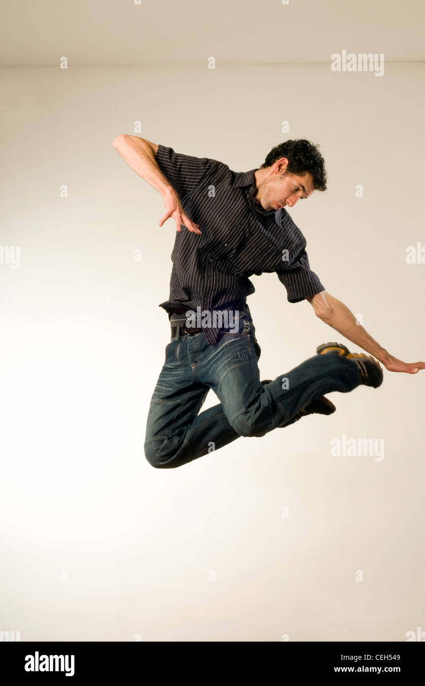 young man jumping Stock Photo - Alamy