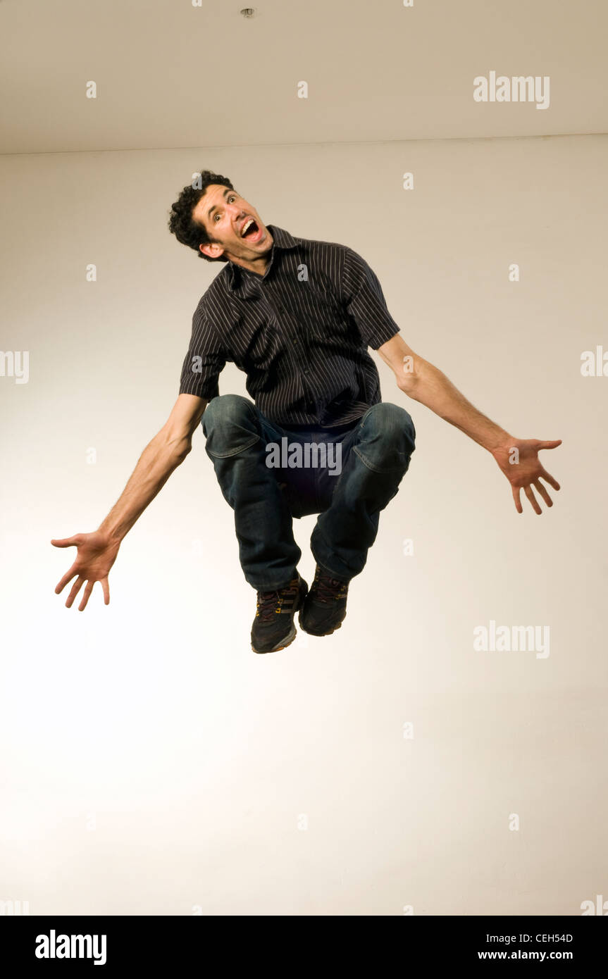 young man jumping Stock Photo - Alamy