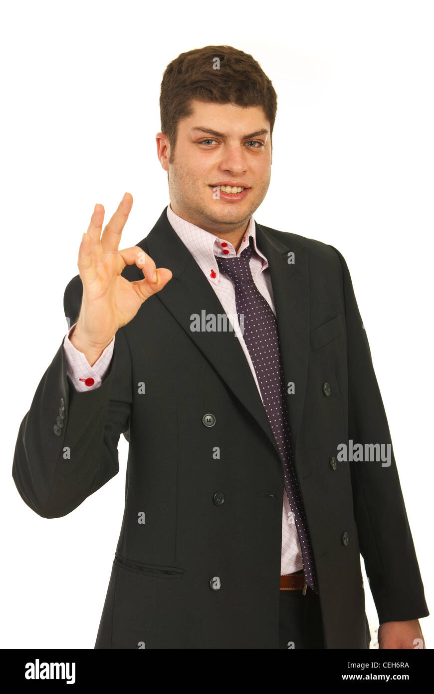 Successful young business man showing okay sign hand gesture isolated ...