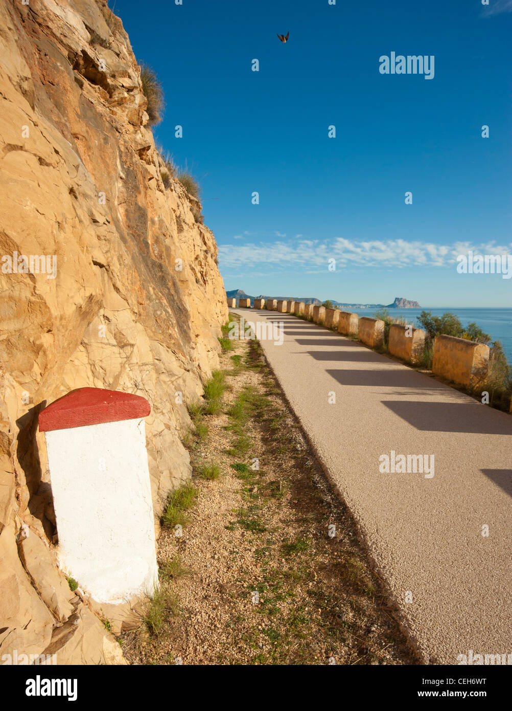 Blank milestone with copy space, scenic mountain road Stock Photo - Alamy
