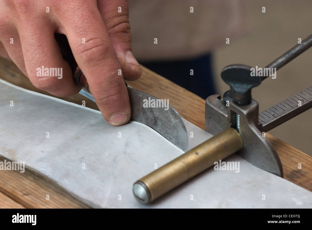 Details of hands sewing leather and harnesses equipment Stock Photo - Alamy