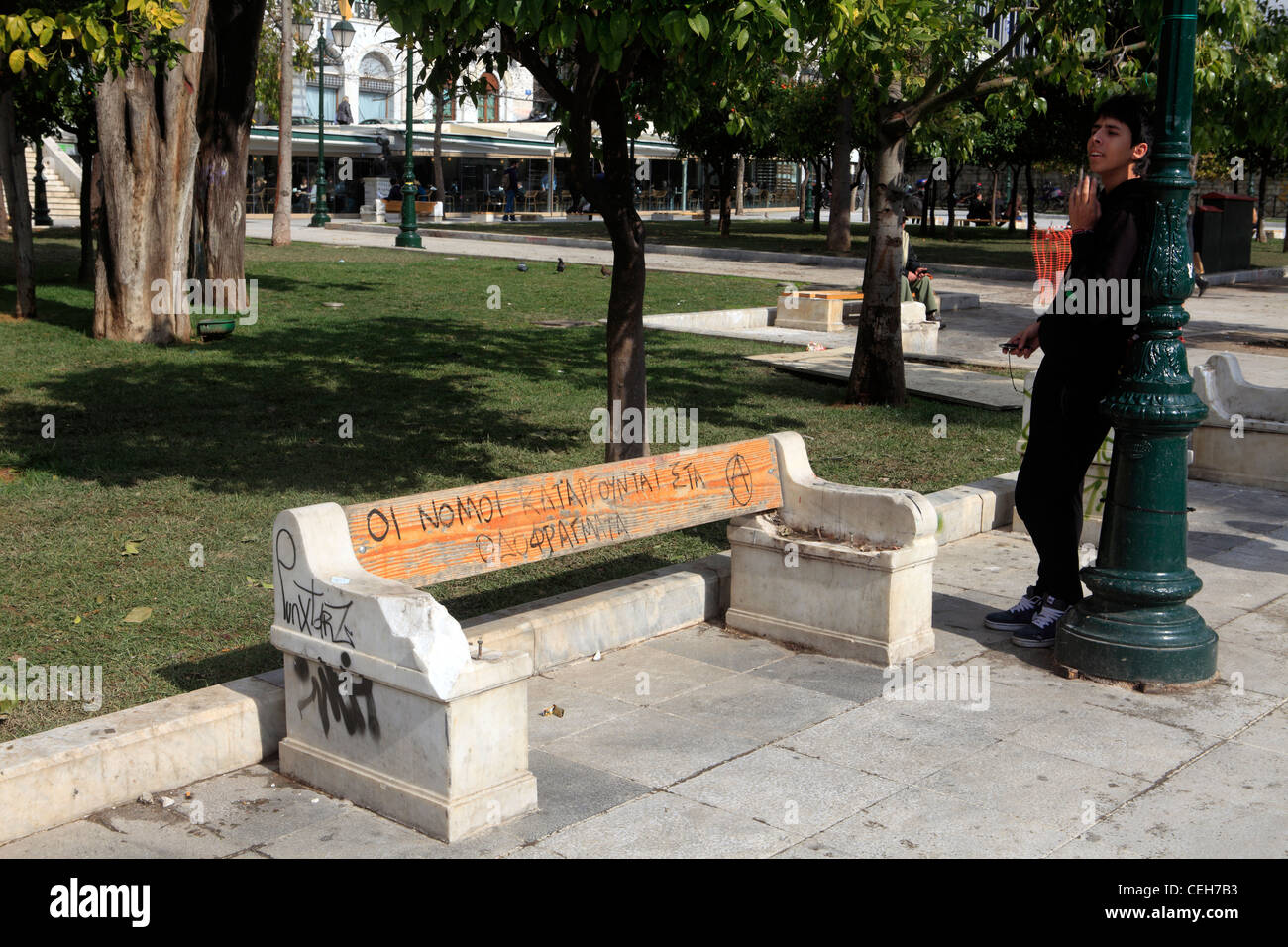 greece athens syntagma square graffiti on a broken bench Stock Photo ...