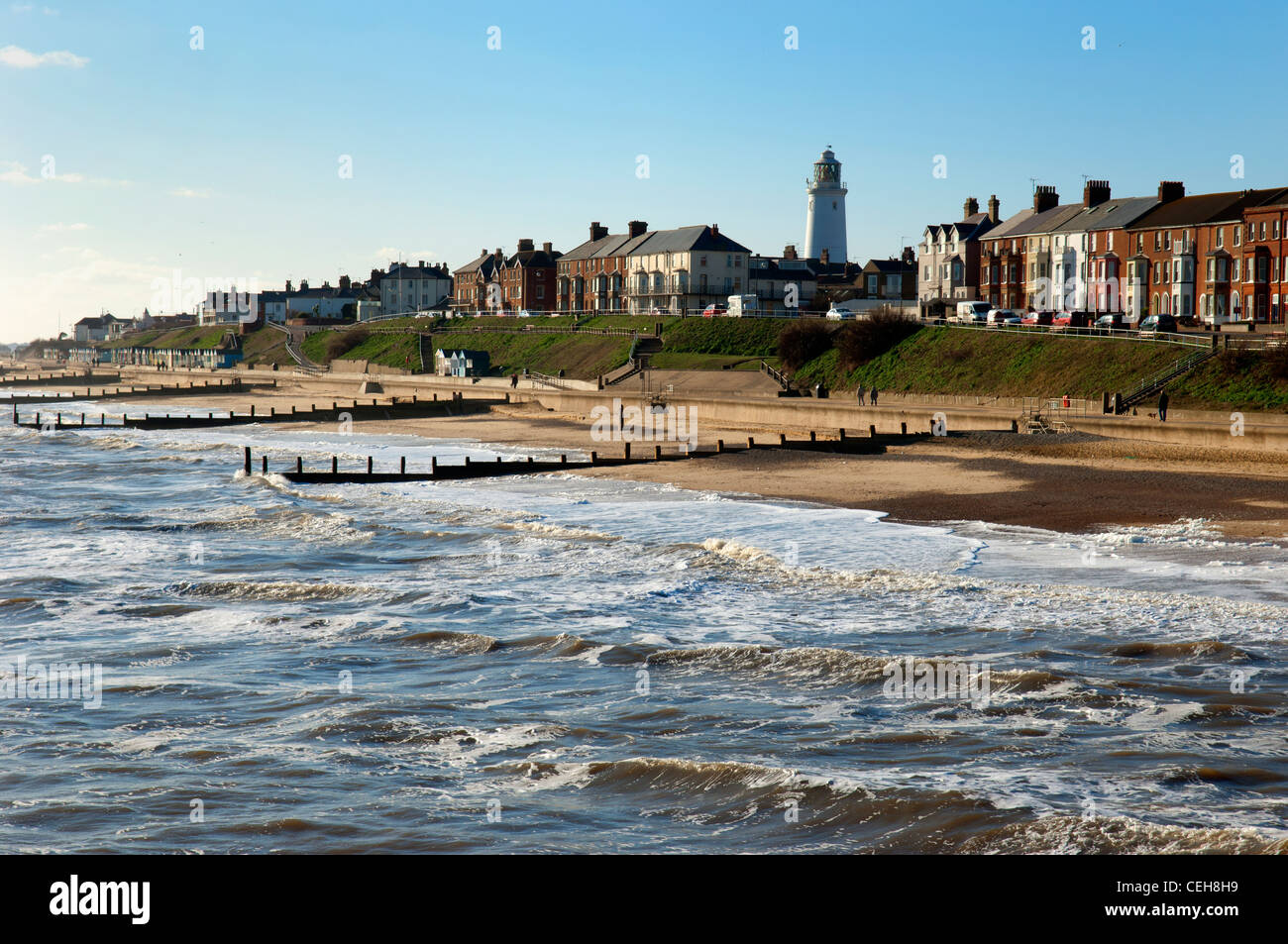 Southwold Pier on a windy day with the waves rolling in onto the beach ...