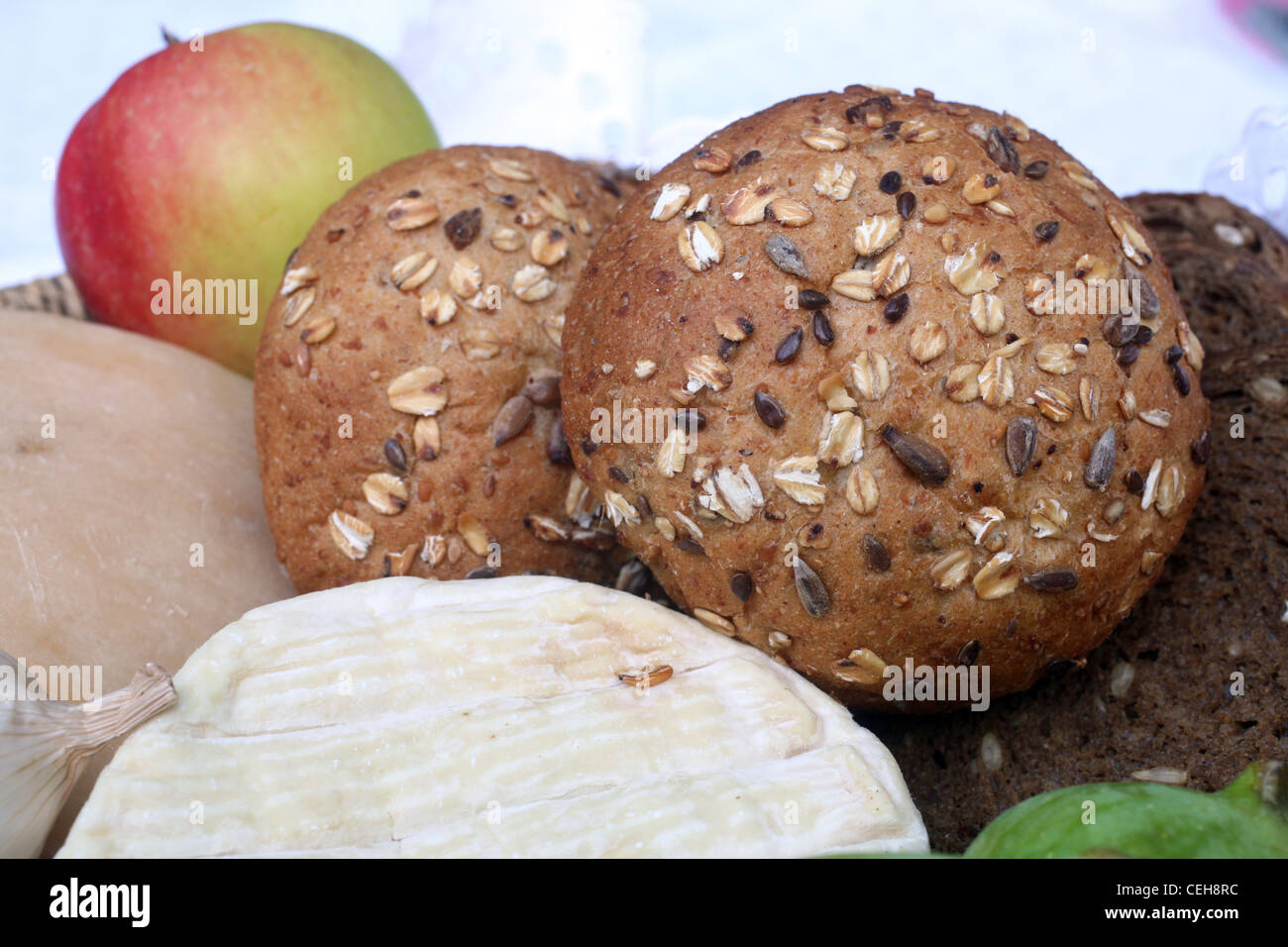 Rustic still life of bread, cheese and apple Stock Photo - Alamy