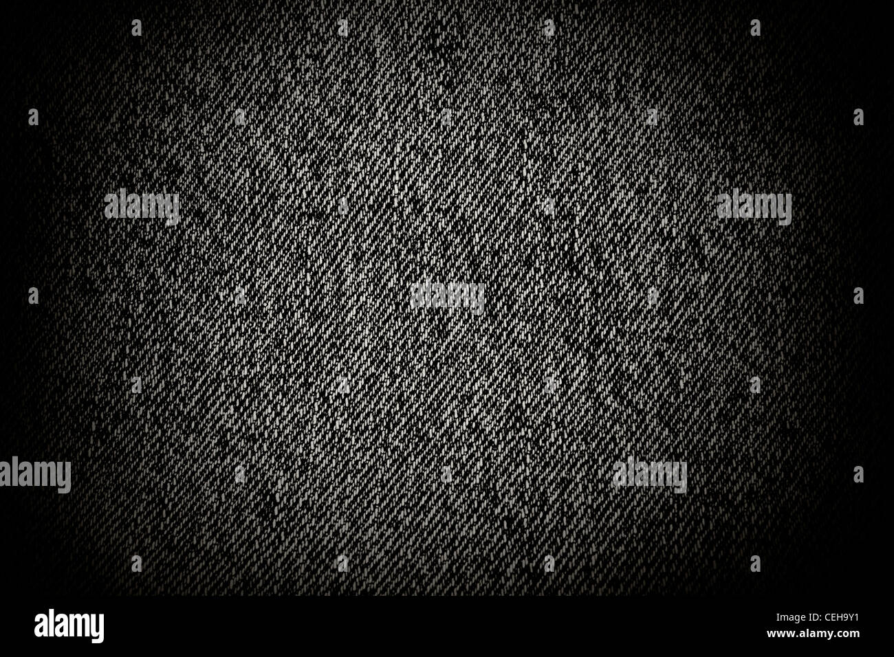 black real textile texture, vignette background to insert text or ...