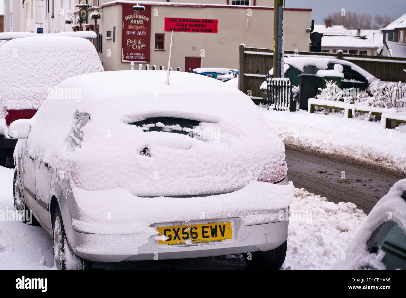 Rear Back View Of A Snow Covered Car Winter UK Stock Photo - Alamy