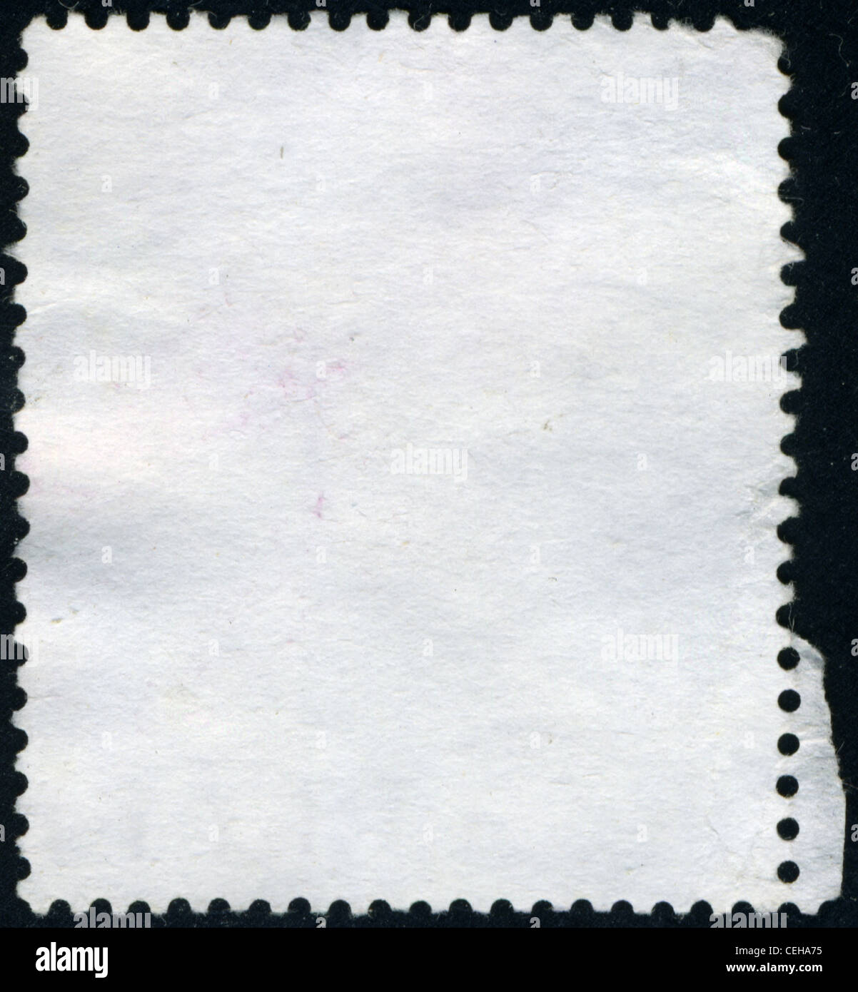 The reverse side of a postage stamp Stock Photo - Alamy