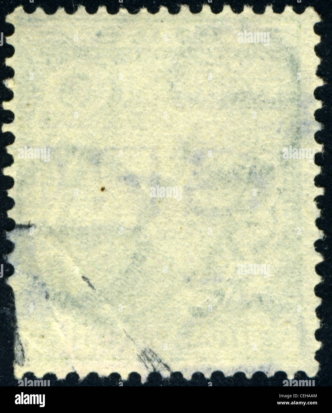 The reverse side of a postage stamp Stock Photo - Alamy