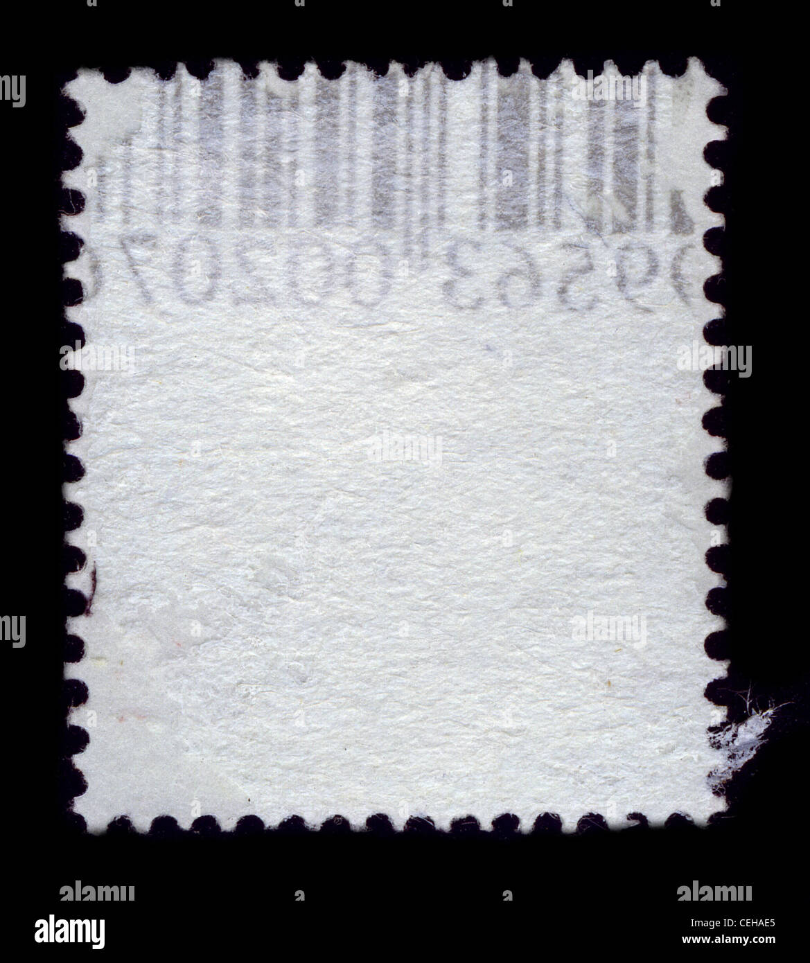 The reverse side of a postage stamp Stock Photo - Alamy