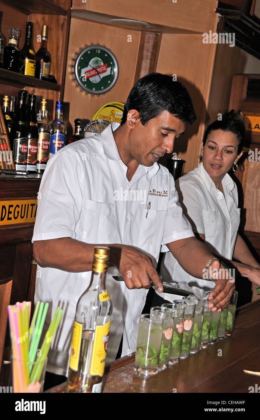 barkeeper mixing Mojitos in cuban bar La Bodeguita, Cuba, Caribbean ...