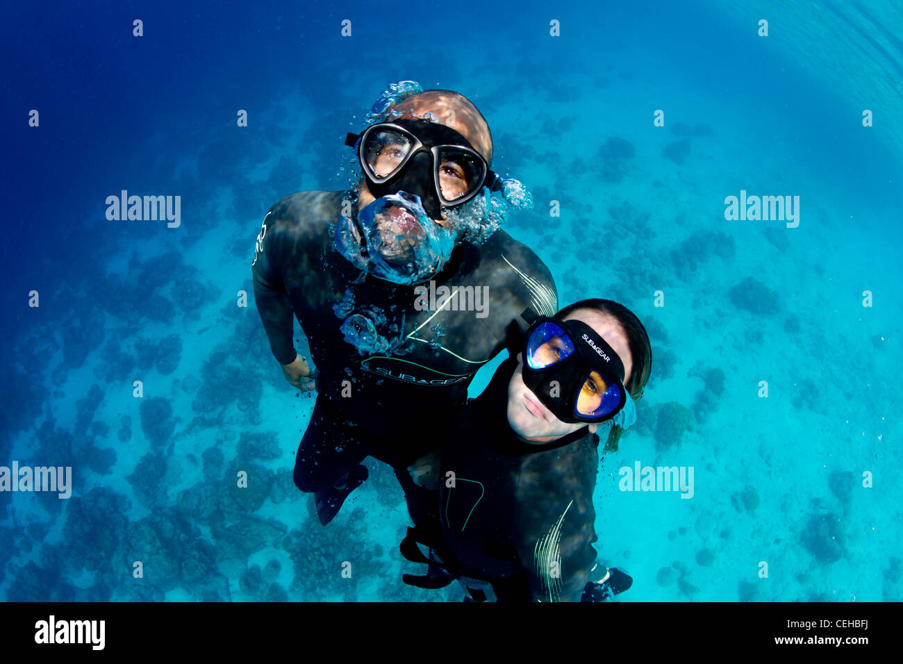 Freedivers ascending towards surface Stock Photo - Alamy