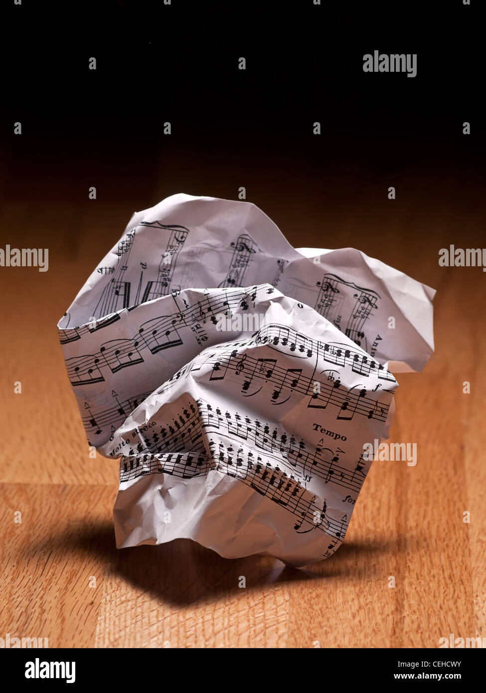crumpled paper sheet of music notes on the floor, closeup,for music ...