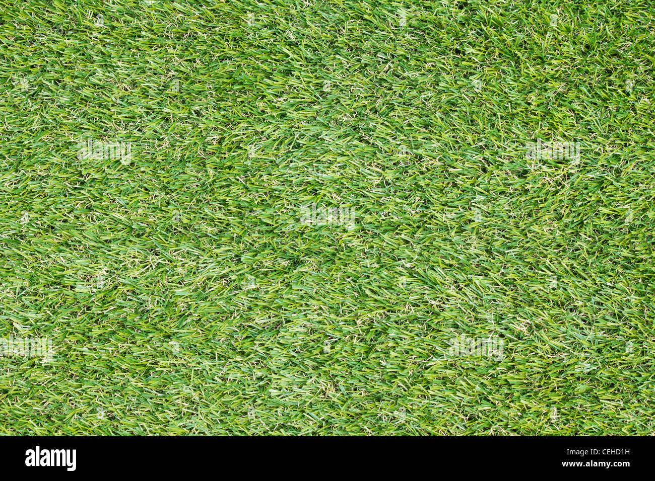 Background texture with fake grass in a public children playground, top ...