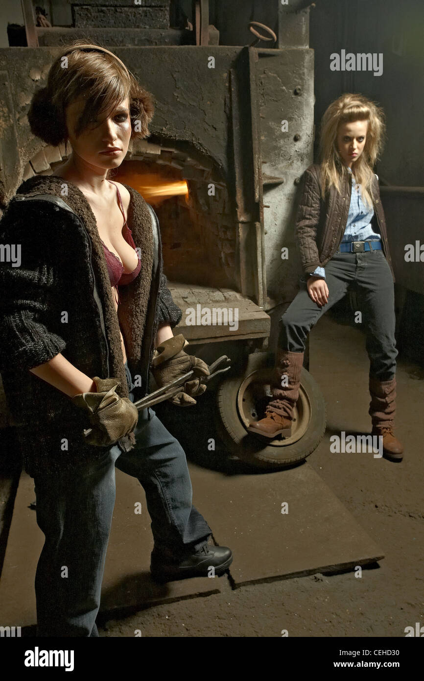 Stylish working women in factory Stock Photo - Alamy