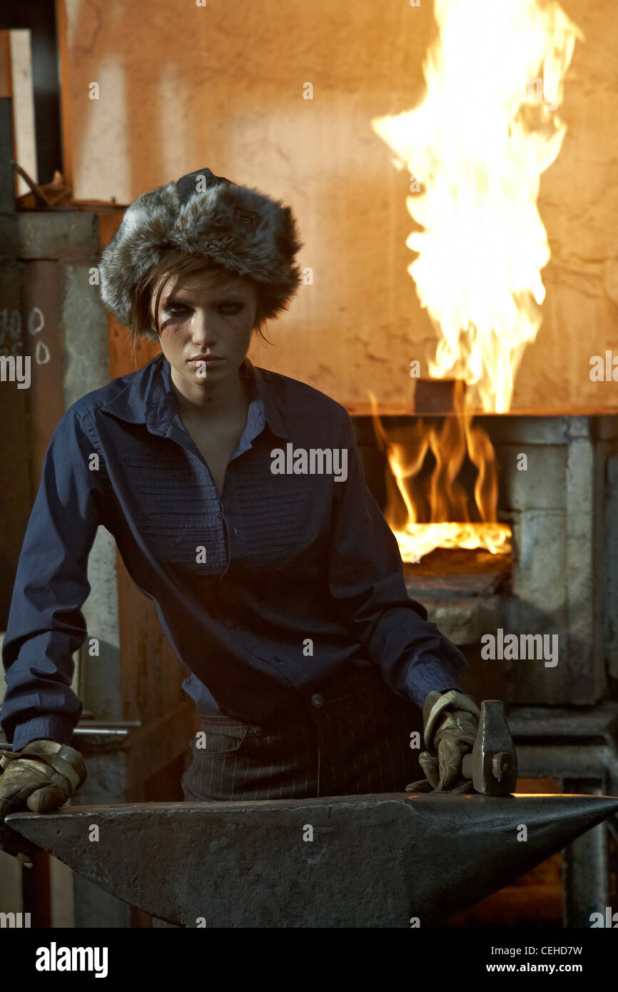 Stylish working woman in old factory Stock Photo - Alamy