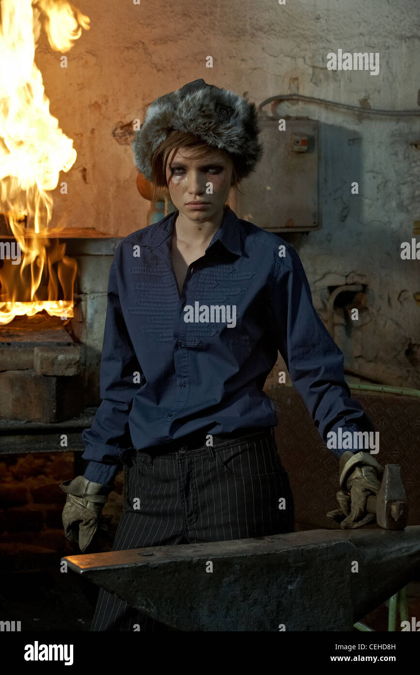 Stylish working woman in old factory Stock Photo - Alamy
