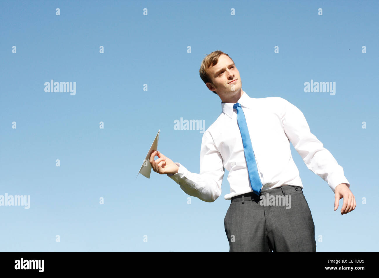 A business man throwing a paper plane Stock Photo - Alamy