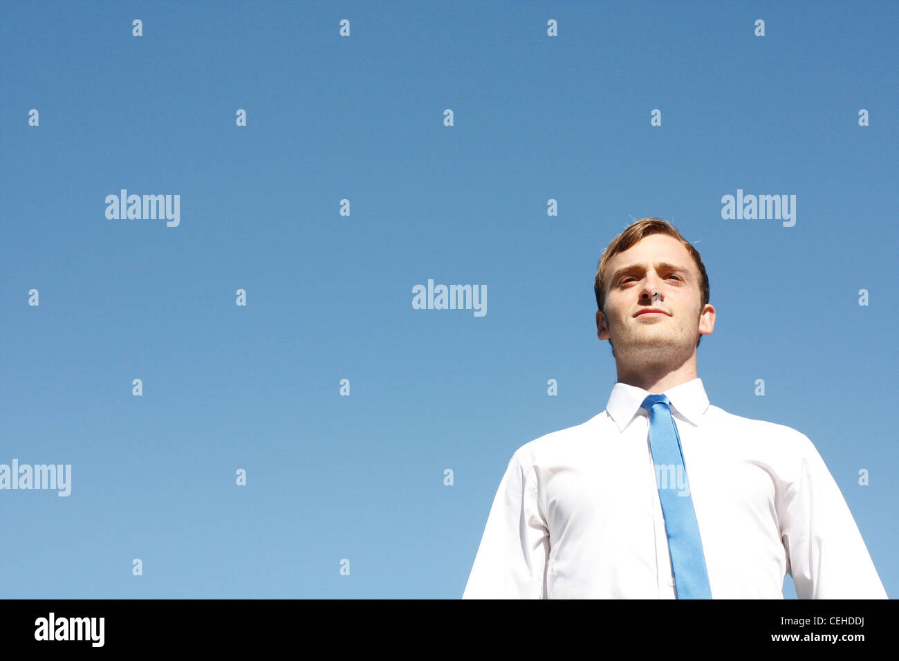A business man and a blue background Stock Photo - Alamy