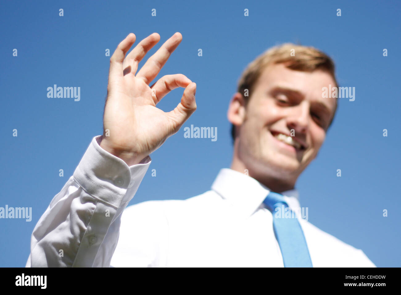 A business man displaying OK signs Stock Photo - Alamy