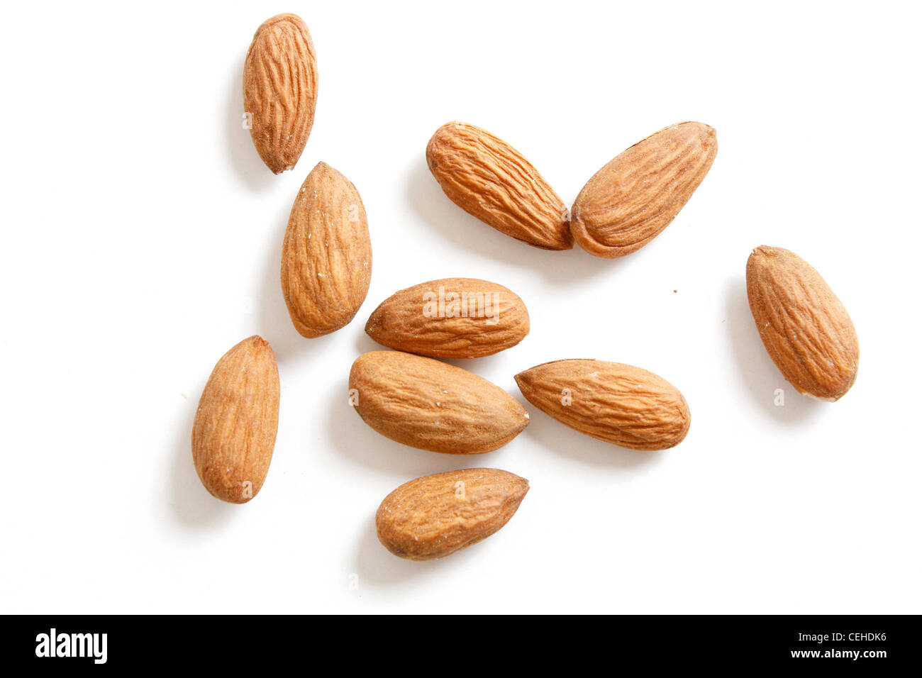 Almonds isolated on white Stock Photo - Alamy